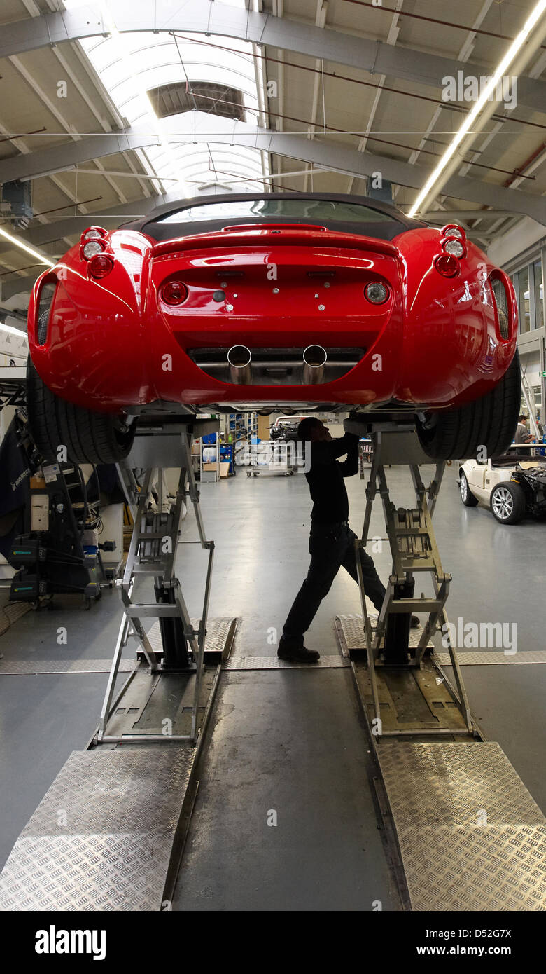 An employee of Wiesmann assembles parts of a Wiesmann roadster MF5 at ...