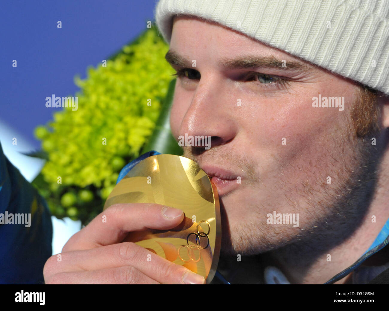 Gold medalist Giuliano Razzoli of Italy kisses his gold medal during ...