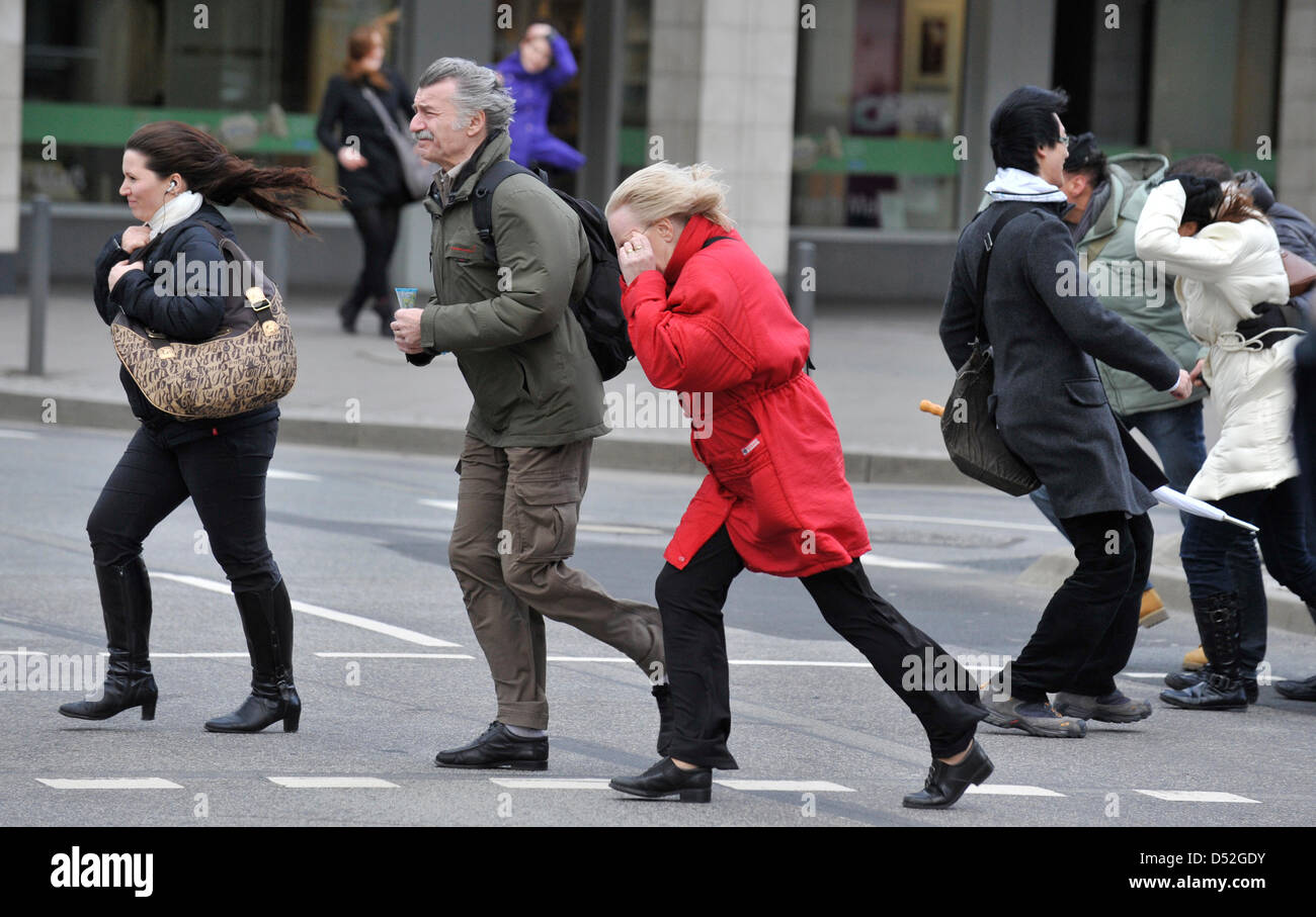 People struggle against the wind in Frankfurt Main, Germany, 28 ...