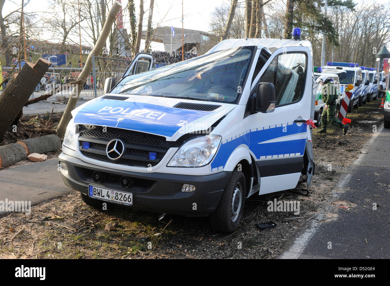 A policecar, destroyed by a tree, stands at the Wildparkstadium in ...
