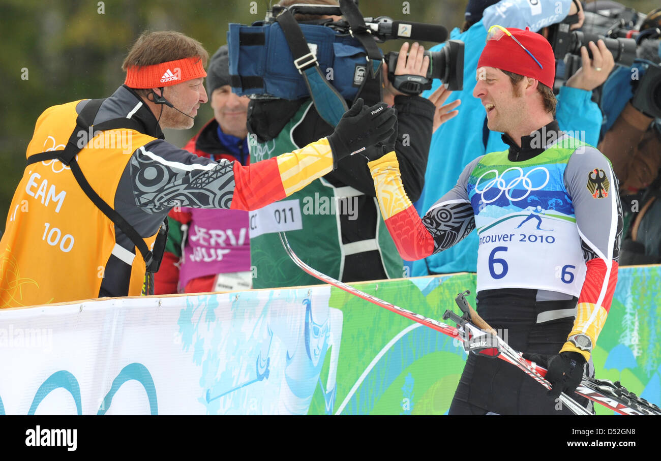 German Coach Jochen Behle (L) and Axel Teichmann of Germany celebrate ...