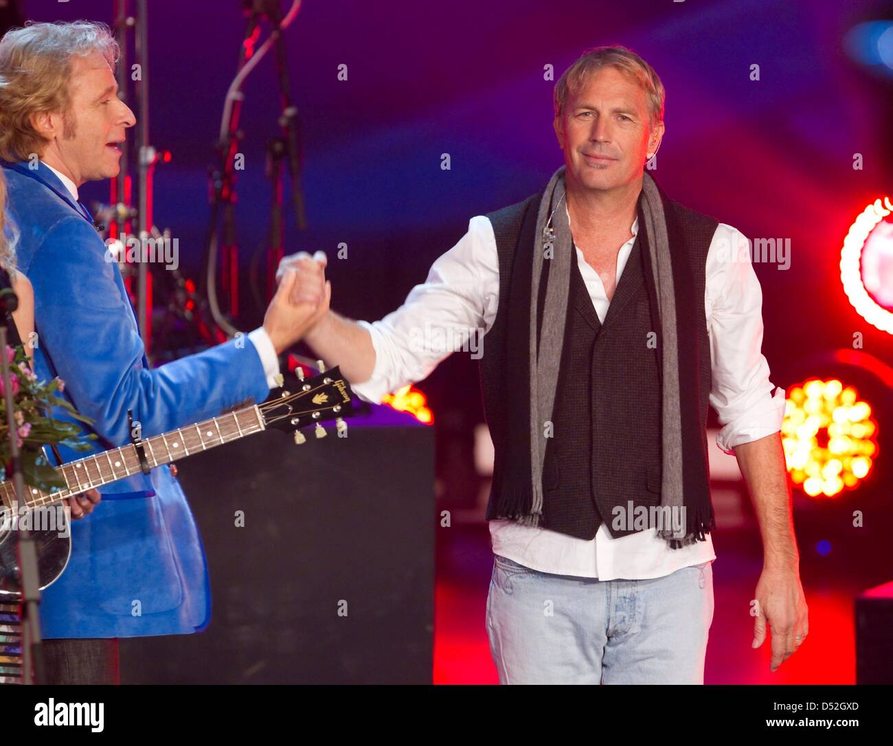 US actor Kevin Costner (C) performs with his band during the live ...