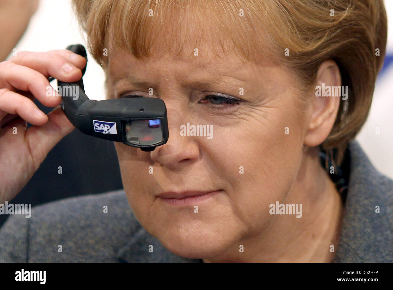 German Chancellor Angela Merkel takes a look through data glasses ...