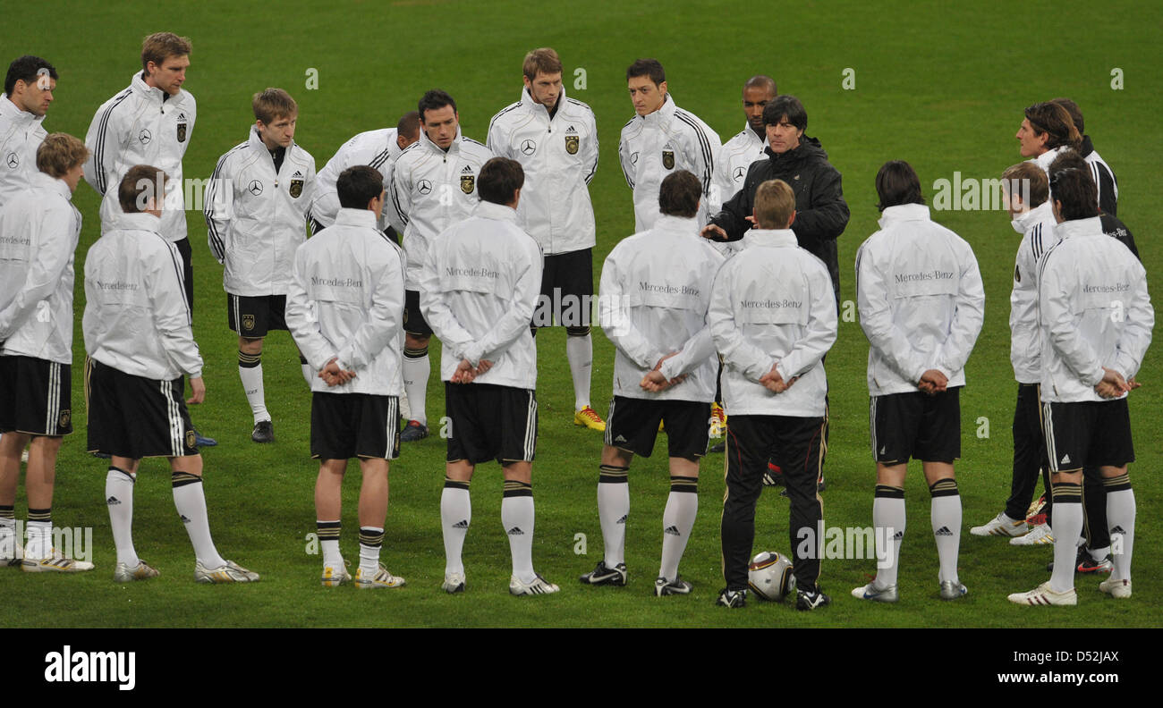 Germany head coach Joachim Loew (black track suit top) talks to his ...
