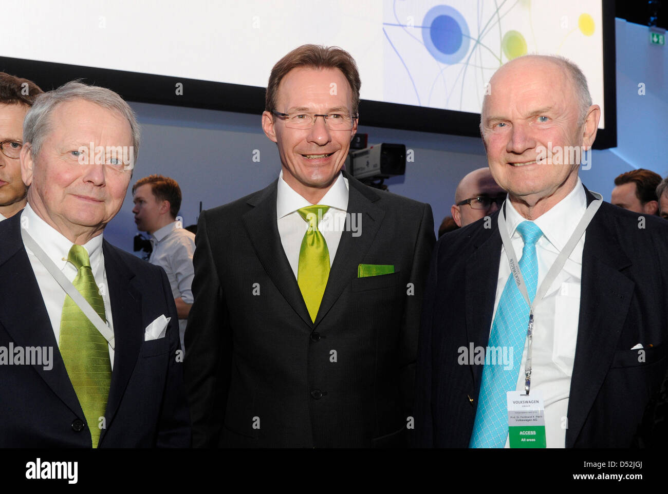 The CEO of Porsche, Michael Macht (C), the chairman of Porsche's ...