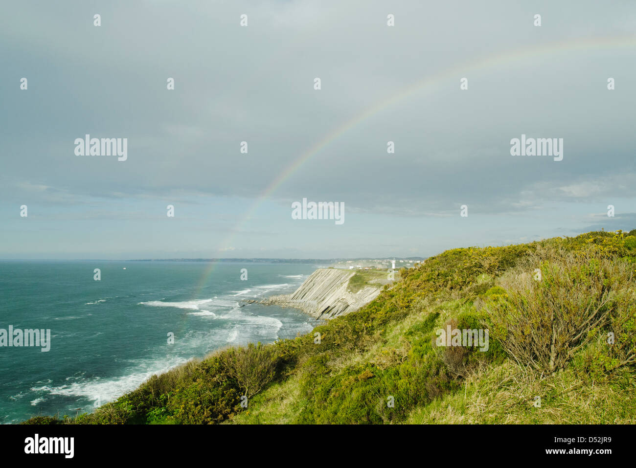 Rainbow on the cliffs of Ciboure, France Stock Photo - Alamy