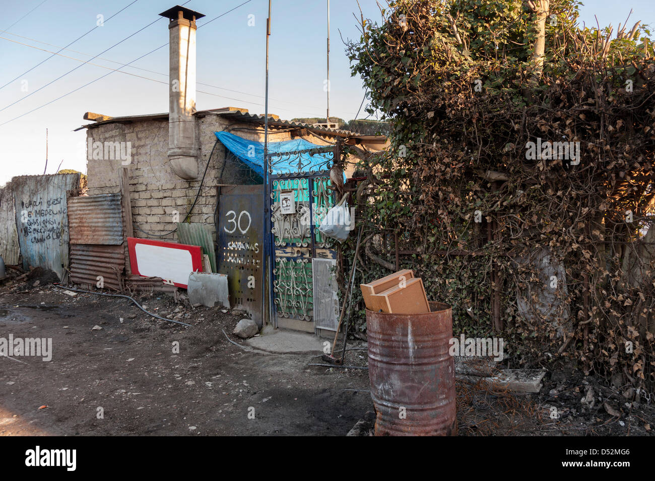 Around 20 Filipino families live in poor houses near the river Tiber in ...
