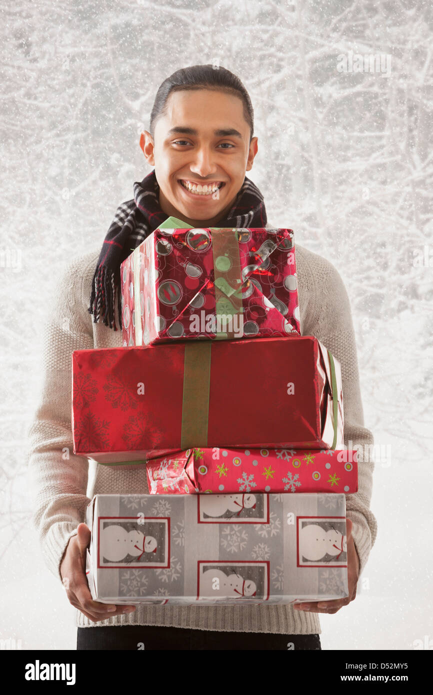 Man carrying stack christmas presents hi-res stock photography and ...