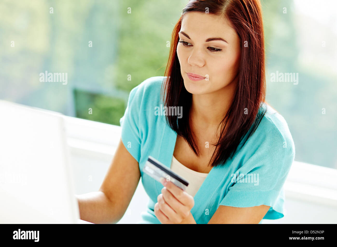 Happy girl shopping online Stock Photo - Alamy