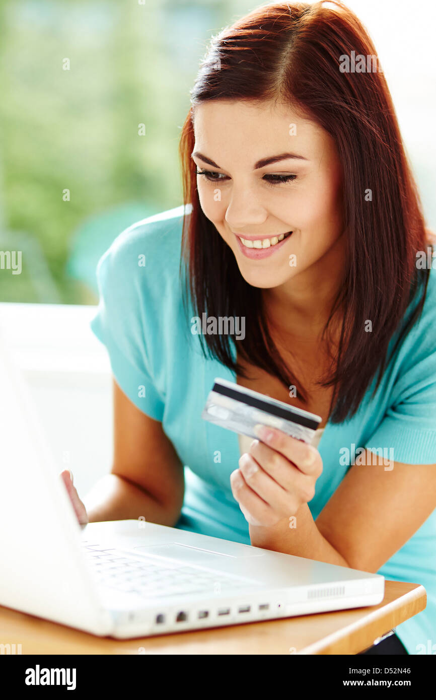 Happy girl shopping online Stock Photo - Alamy