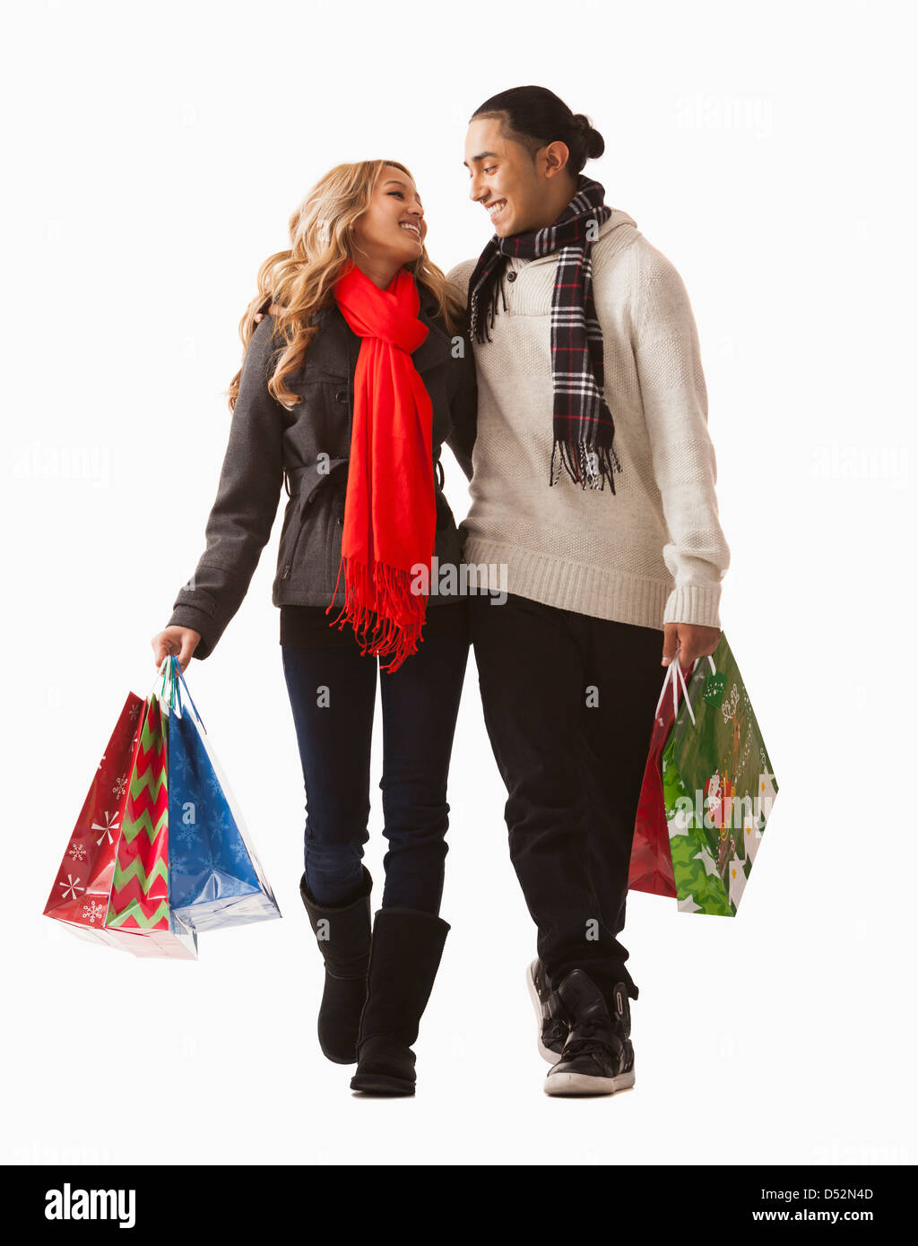 Couple carrying shopping bags Stock Photo - Alamy