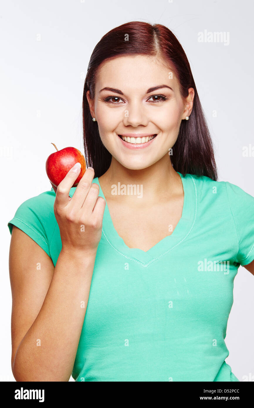 Girl holding an Apple Stock Photo - Alamy