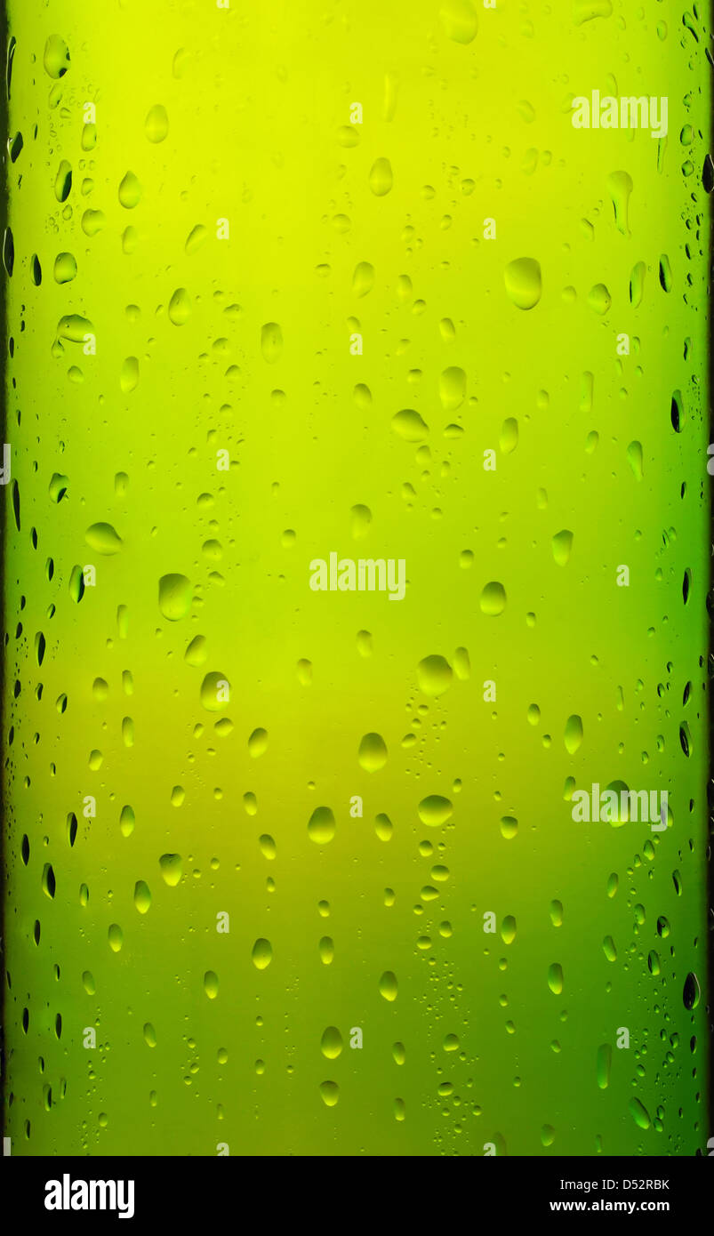 Green bottle glass with drops Stock Photo - Alamy