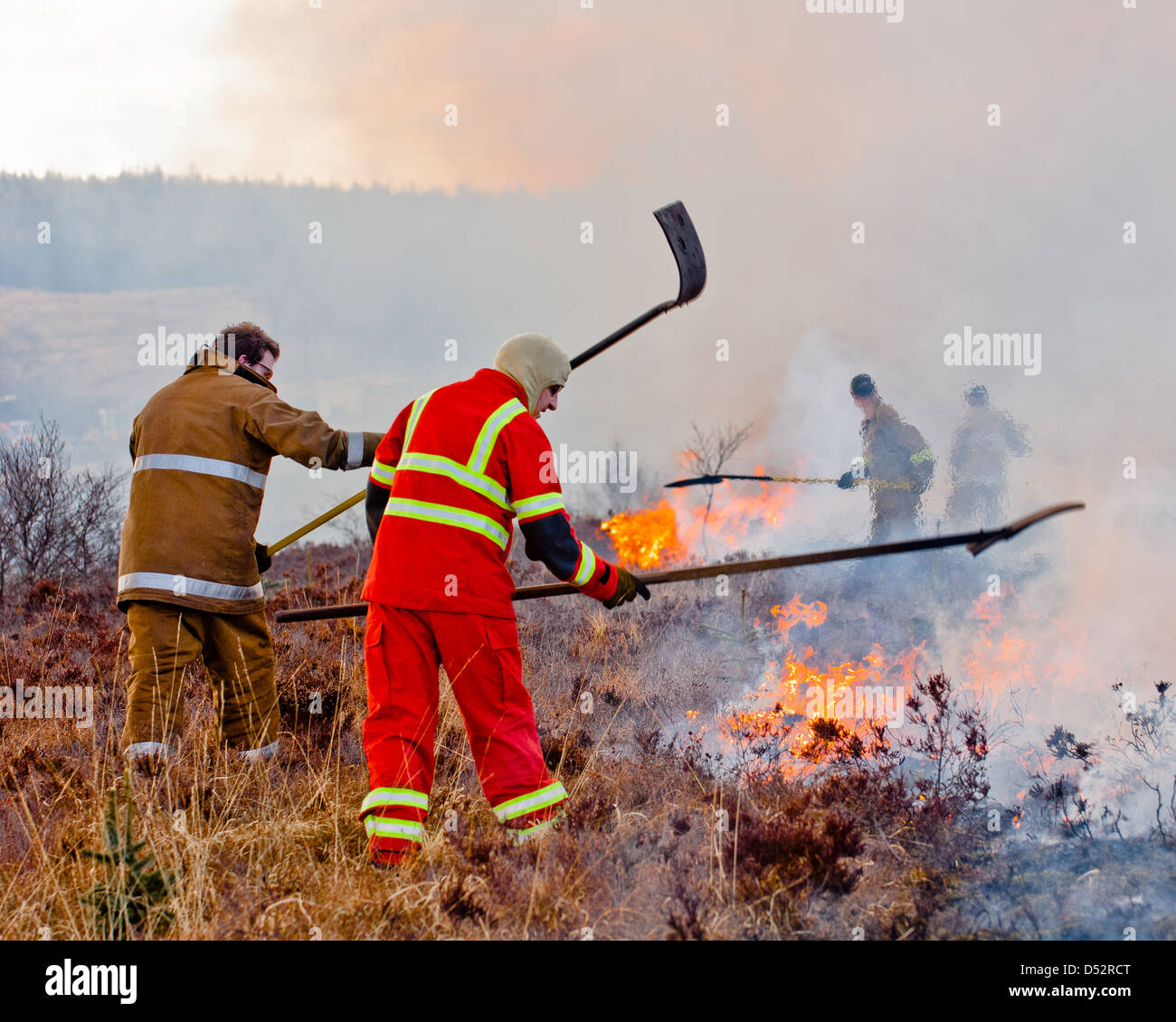 Firemen fight to control a moor hill fire on the west coast of Scotland ...