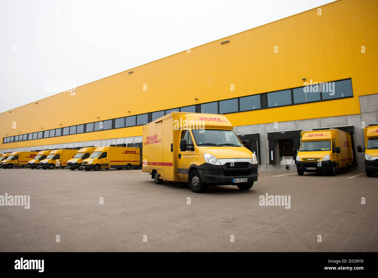 A Deutsche Post DHL mail van leaves the first mechanical delivery point ...