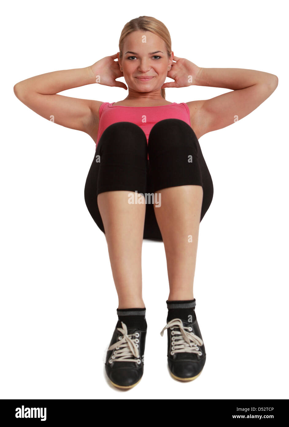 Upper view of a female doing sit-ups isolated against a white ...