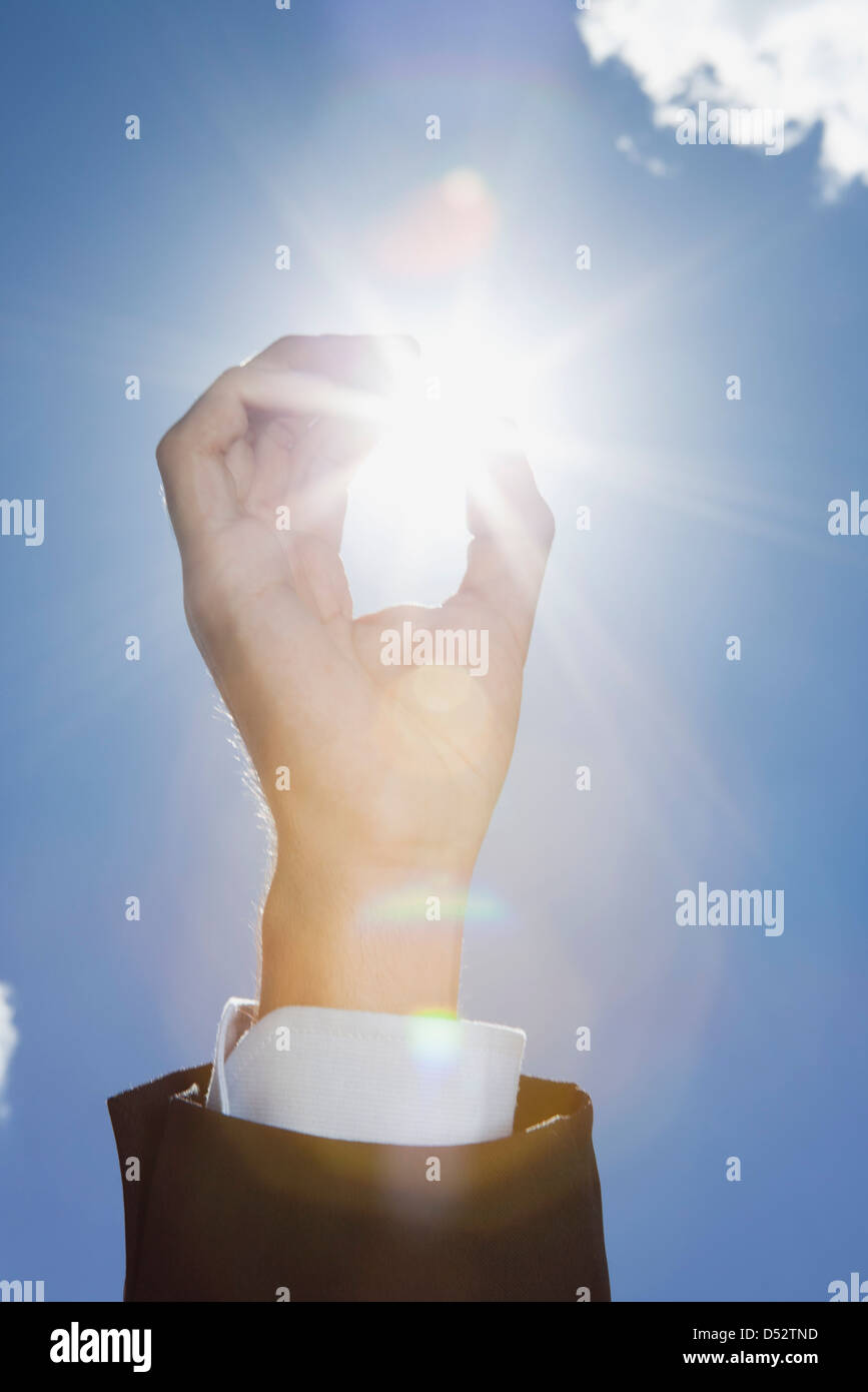 Sunlight through fingers, cropped Stock Photo - Alamy