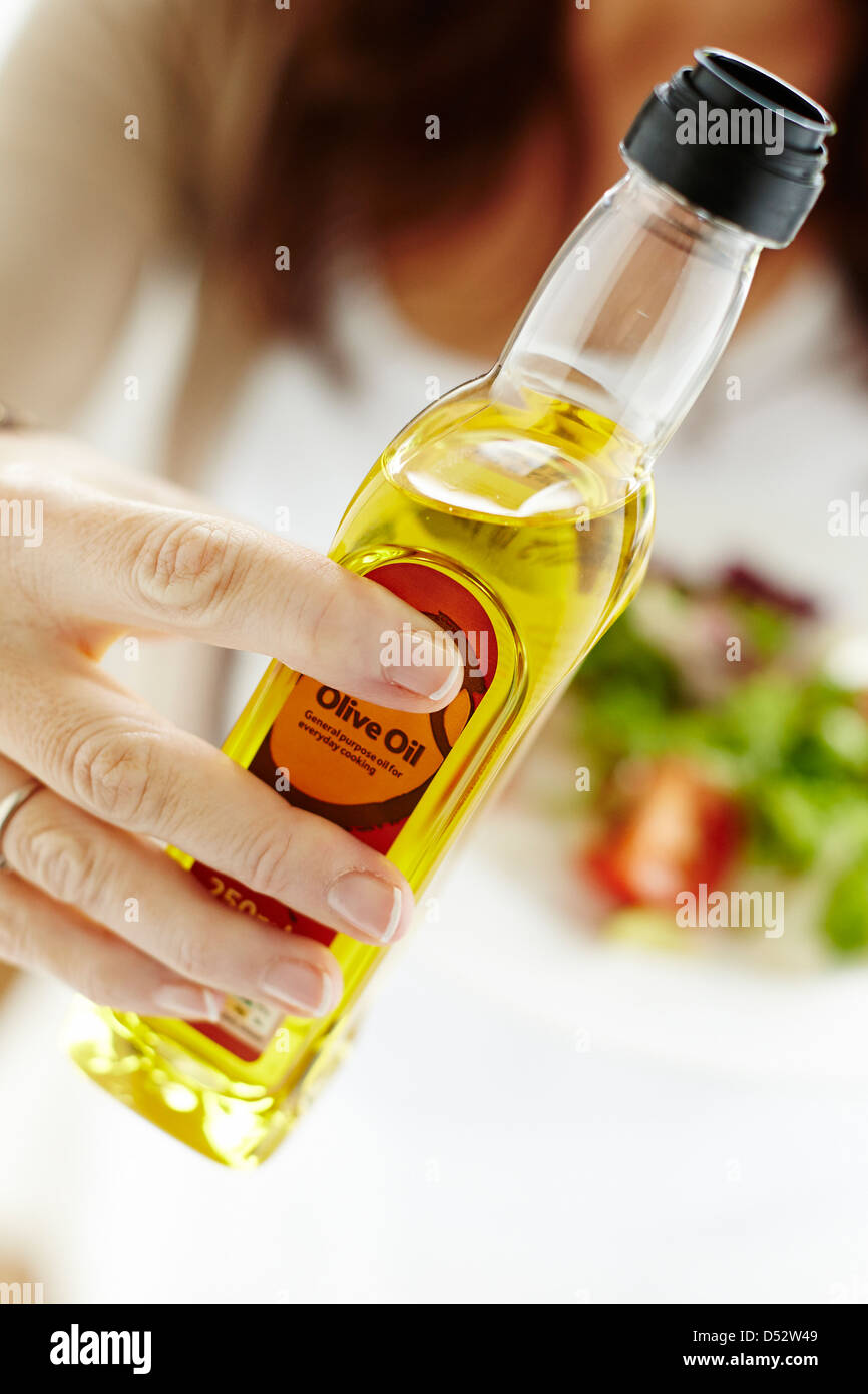 Woman pouring oil hair hi-res stock photography and images - Alamy
