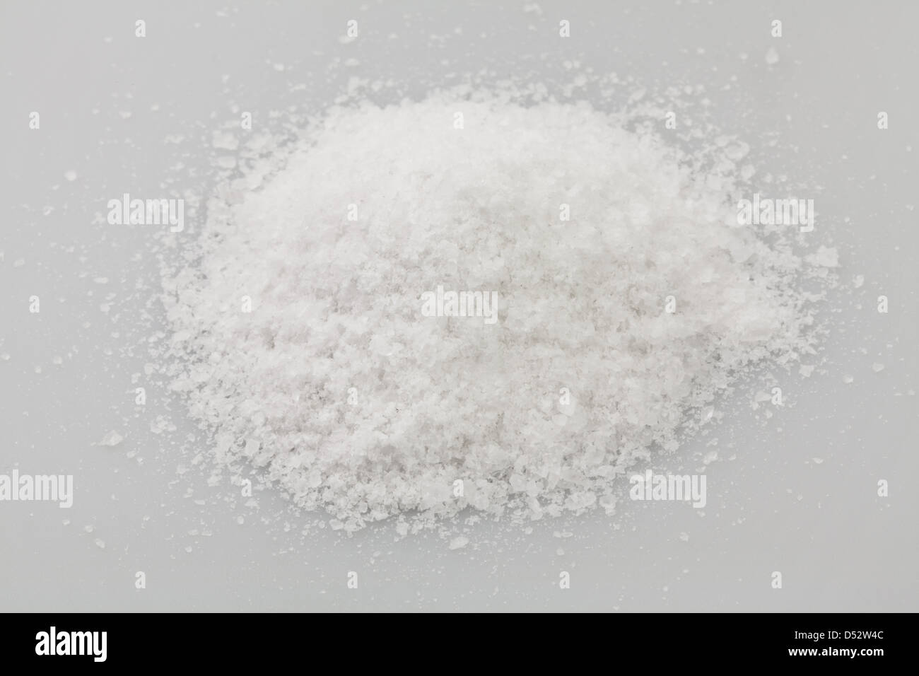 salt heap on gray background Stock Photo - Alamy