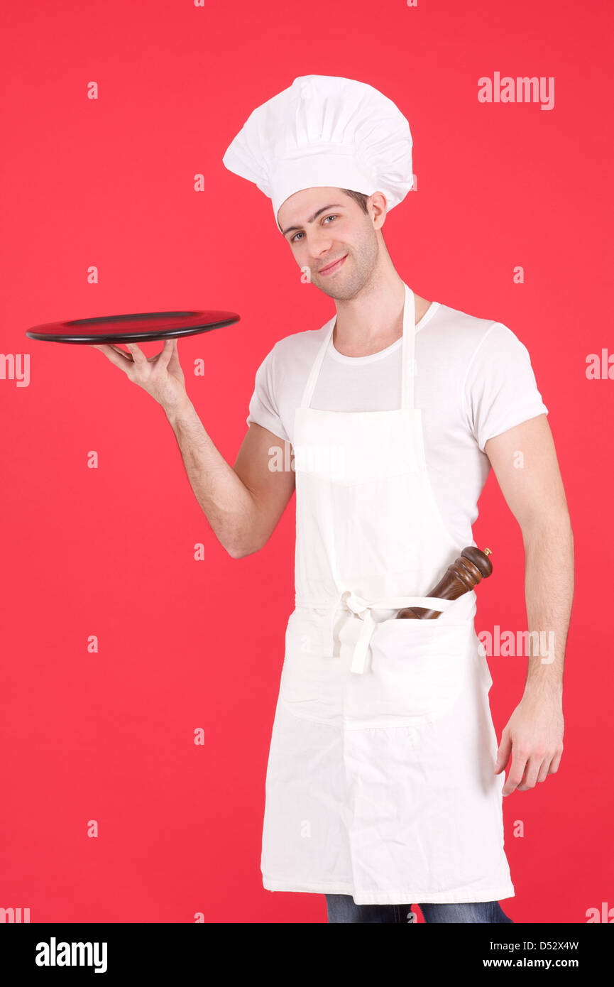 chef shot in red background Stock Photo - Alamy