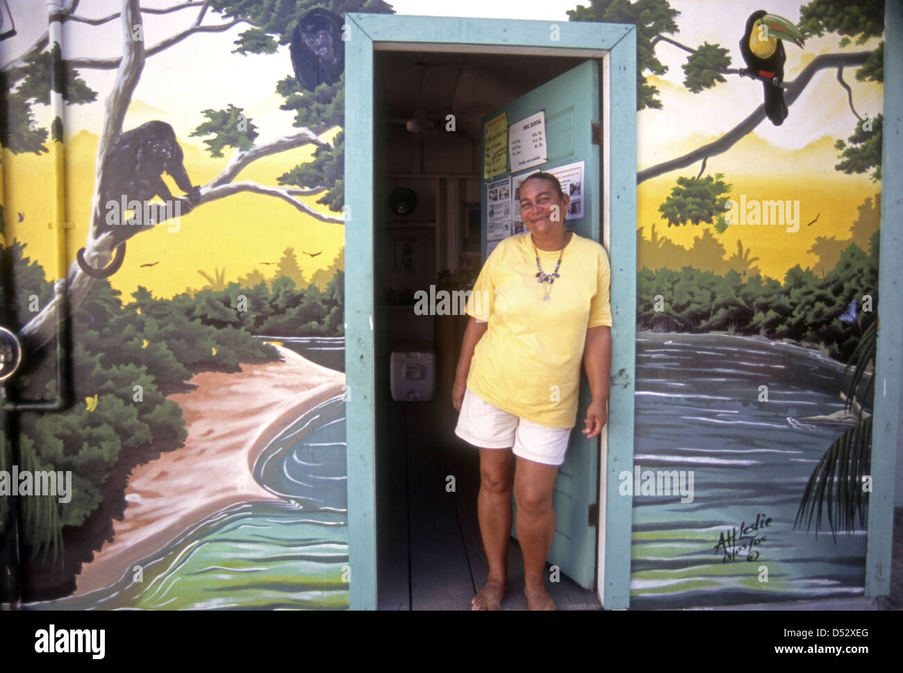 A local creole lady waits in a doorway in Placencia, Belize Stock Photo ...