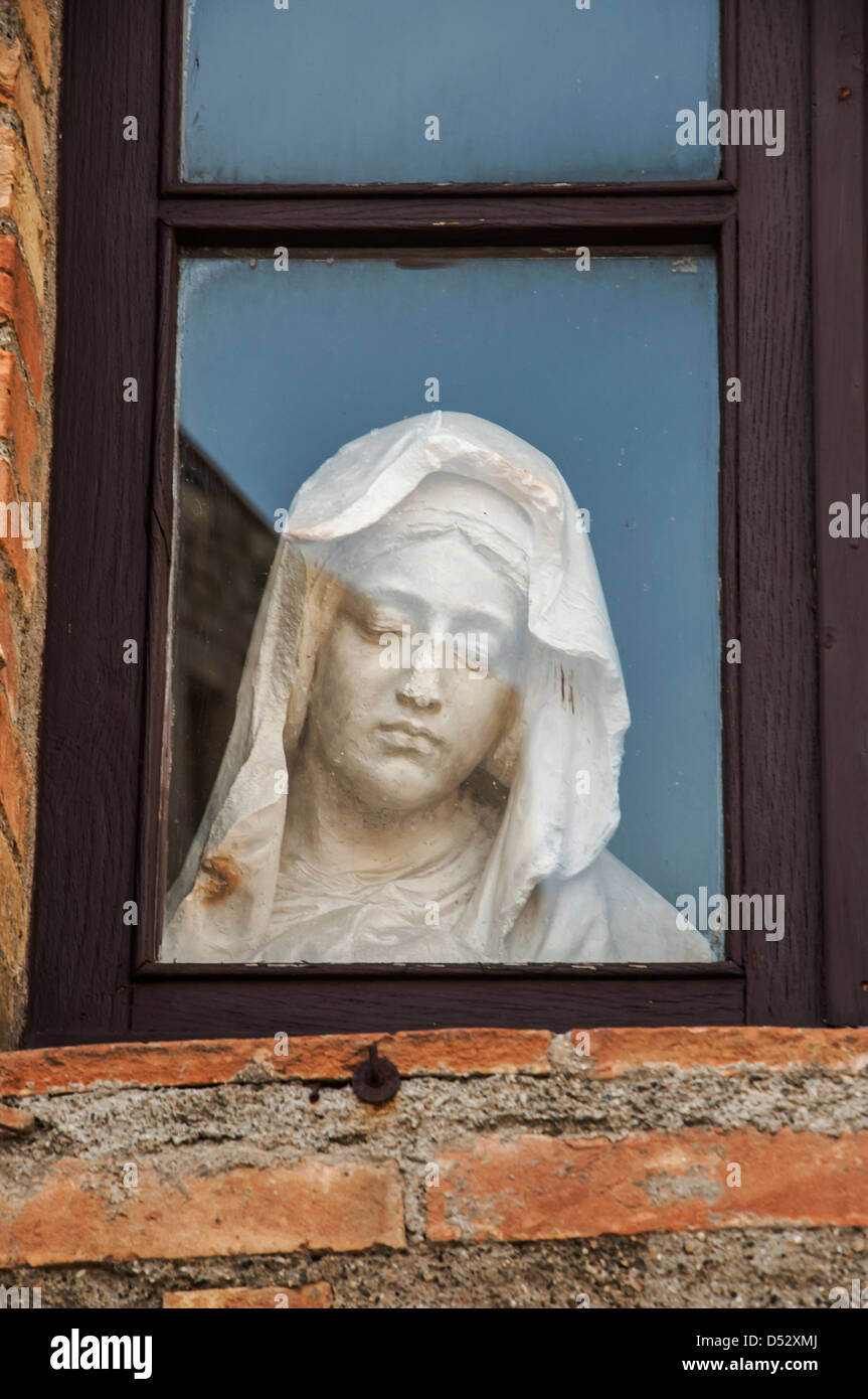 a mary statue inside a window in italian village Stock Photo - Alamy