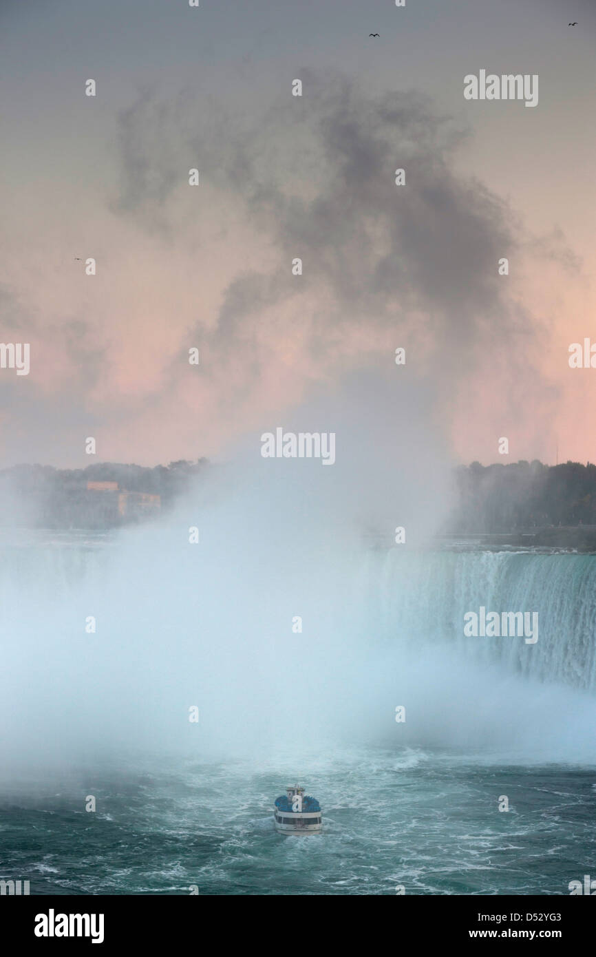 A plume of mist rising high into the evening sky at twilight in Niagara ...