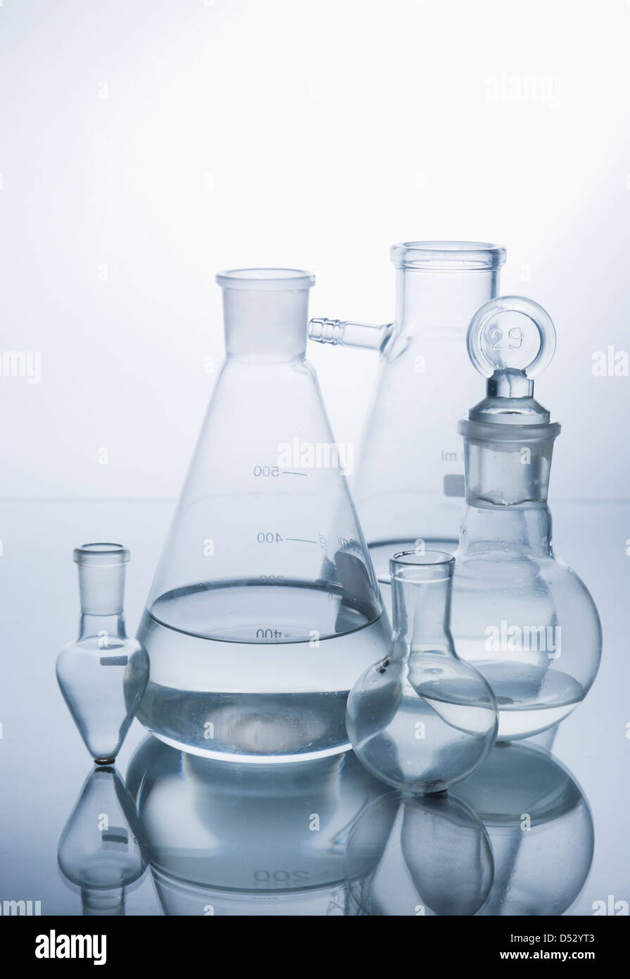 Laboratory glassware over white background Stock Photo - Alamy