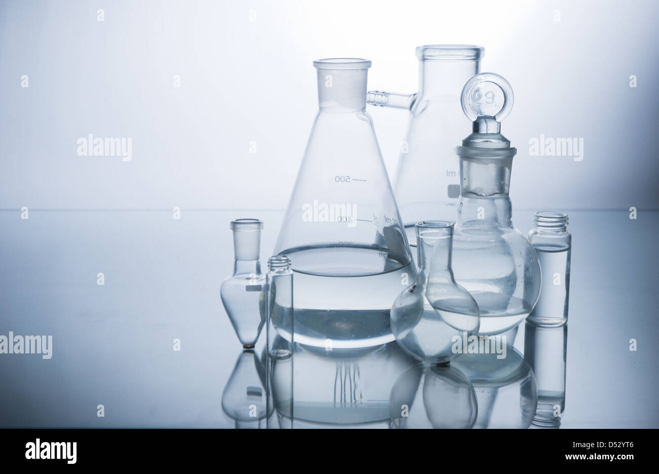 Laboratory glassware over white background Stock Photo - Alamy