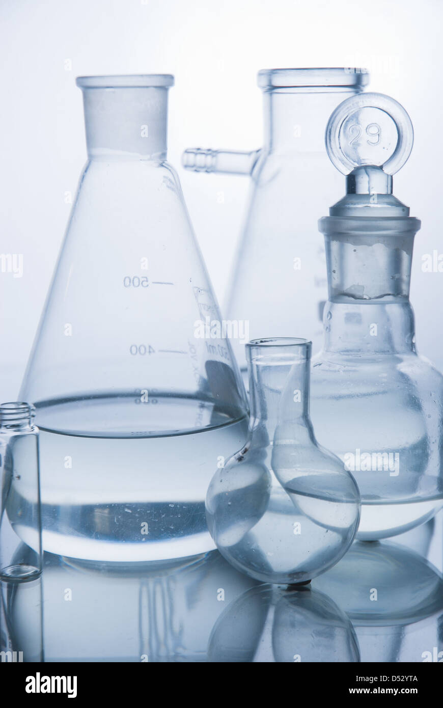 Laboratory glassware over white background Stock Photo - Alamy
