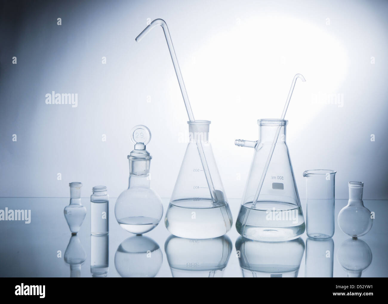 Laboratory glassware over white background Stock Photo - Alamy