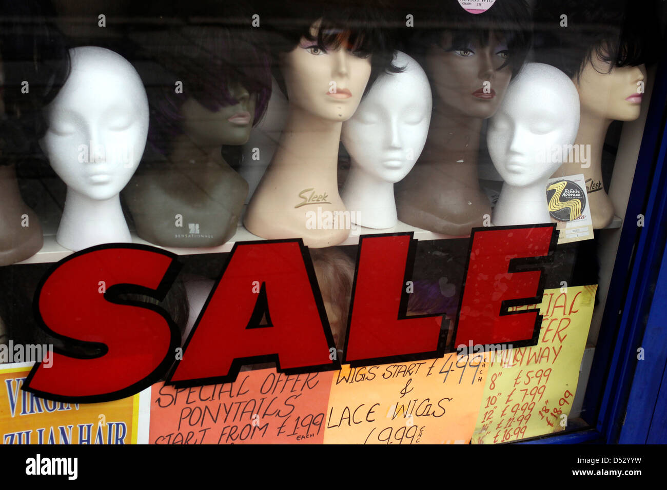 Sale sign on a shop window in London Stock Photo - Alamy