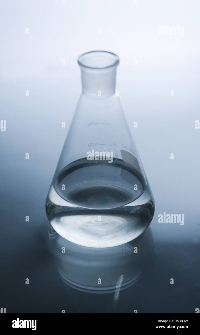 Test-tube with blue liquid isolated on white Stock Photo - Alamy