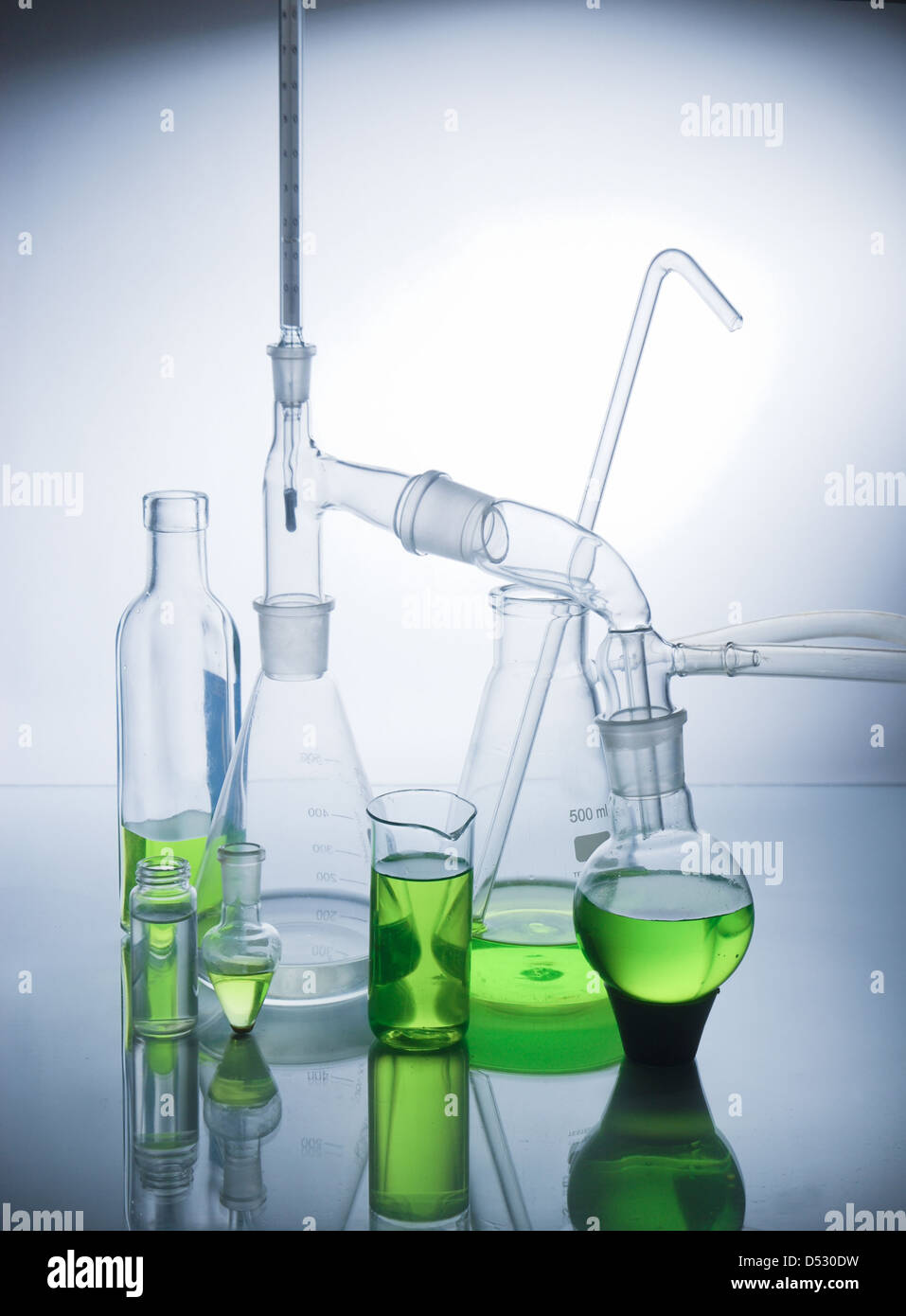 Laboratory glassware over white background Stock Photo - Alamy