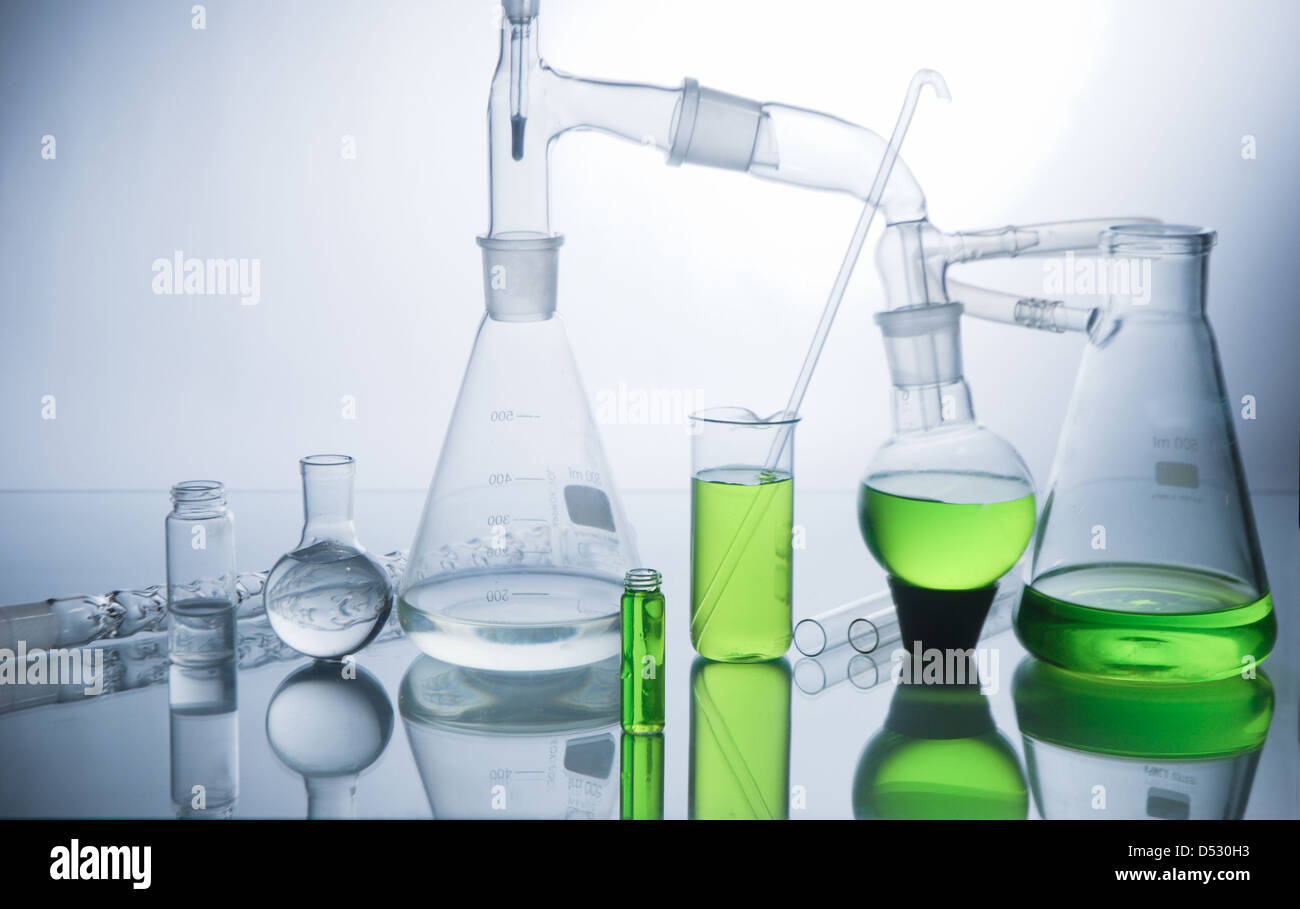 Laboratory glassware over white background Stock Photo - Alamy