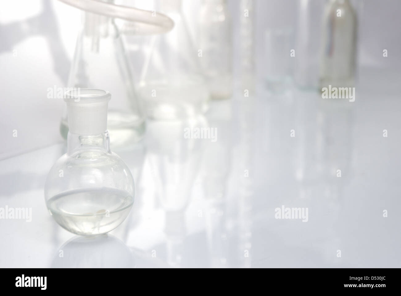 Laboratory glassware over white background Stock Photo - Alamy