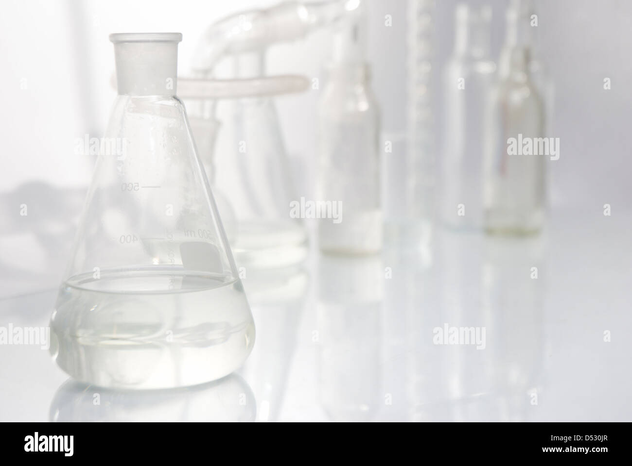 Laboratory glassware over white background Stock Photo - Alamy