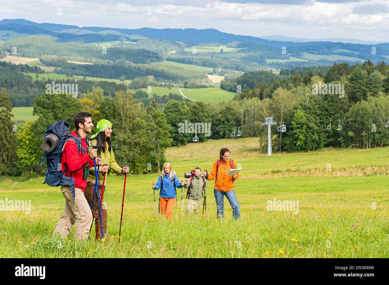 Young trekking people enjoying nature and scenic landscape Stock Photo ...