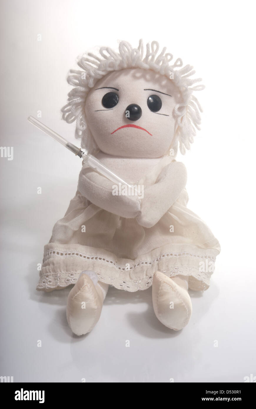 Sick Toy on white background Stock Photo - Alamy