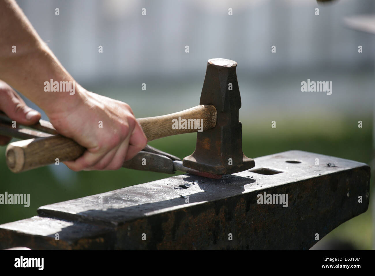 blacksmith at work using traditional methods Stock Photo - Alamy