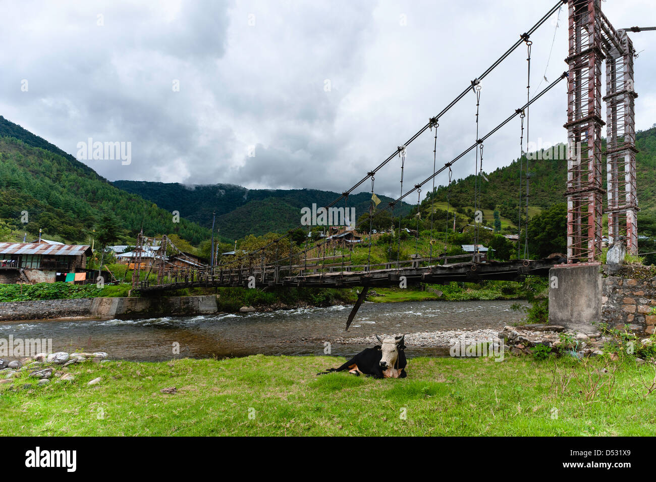 Sangti river with view of suspension bridge and part of Sangti village ...