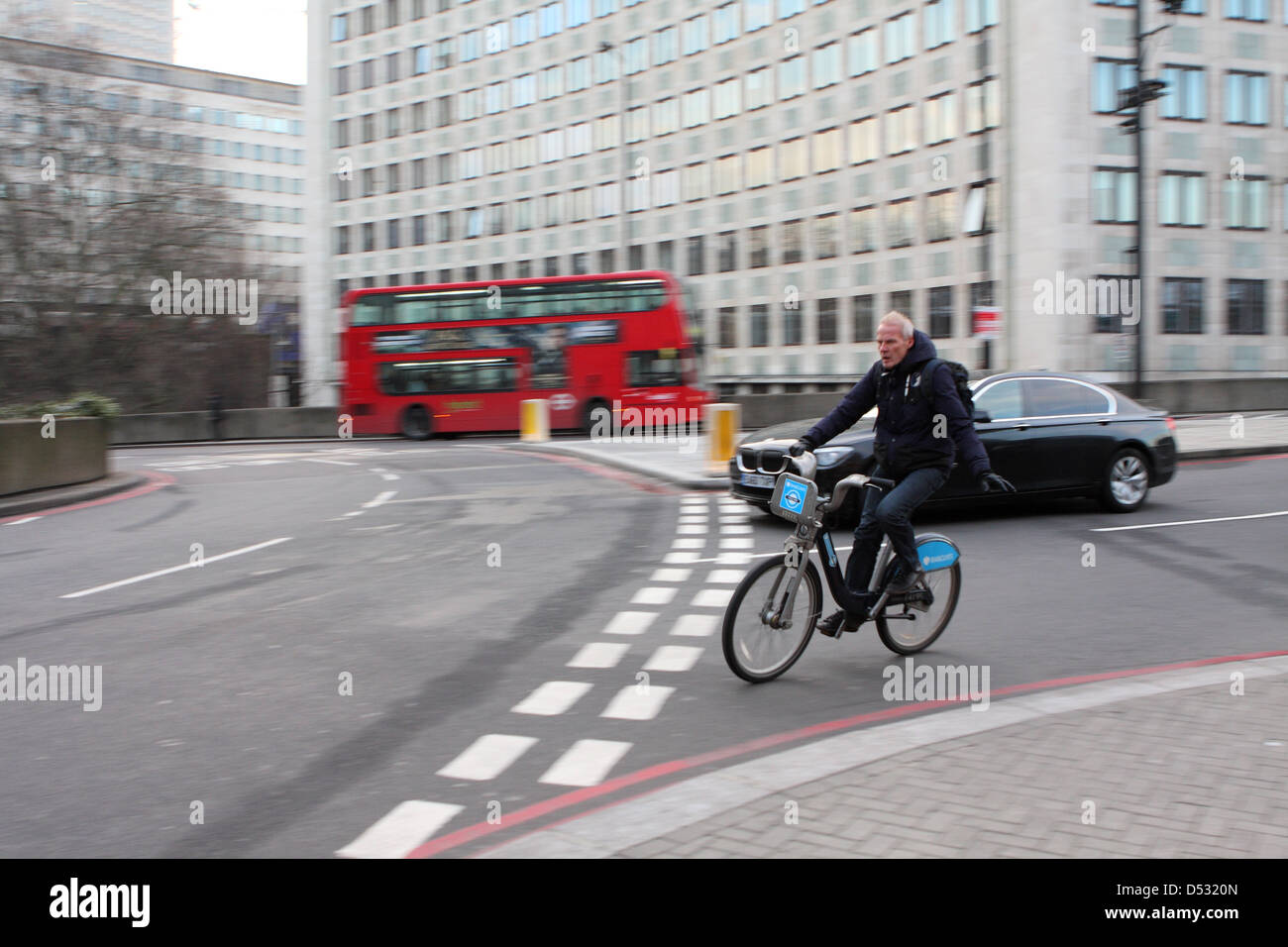 cyclist and traffic entering a roundabout in London, England Stock ...