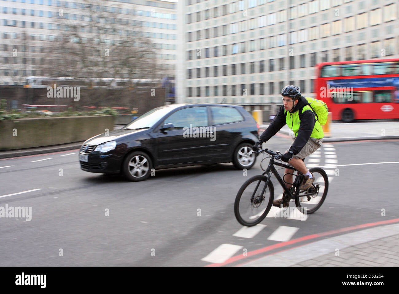 cyclist and traffic entering a roundabout in London, England Stock ...