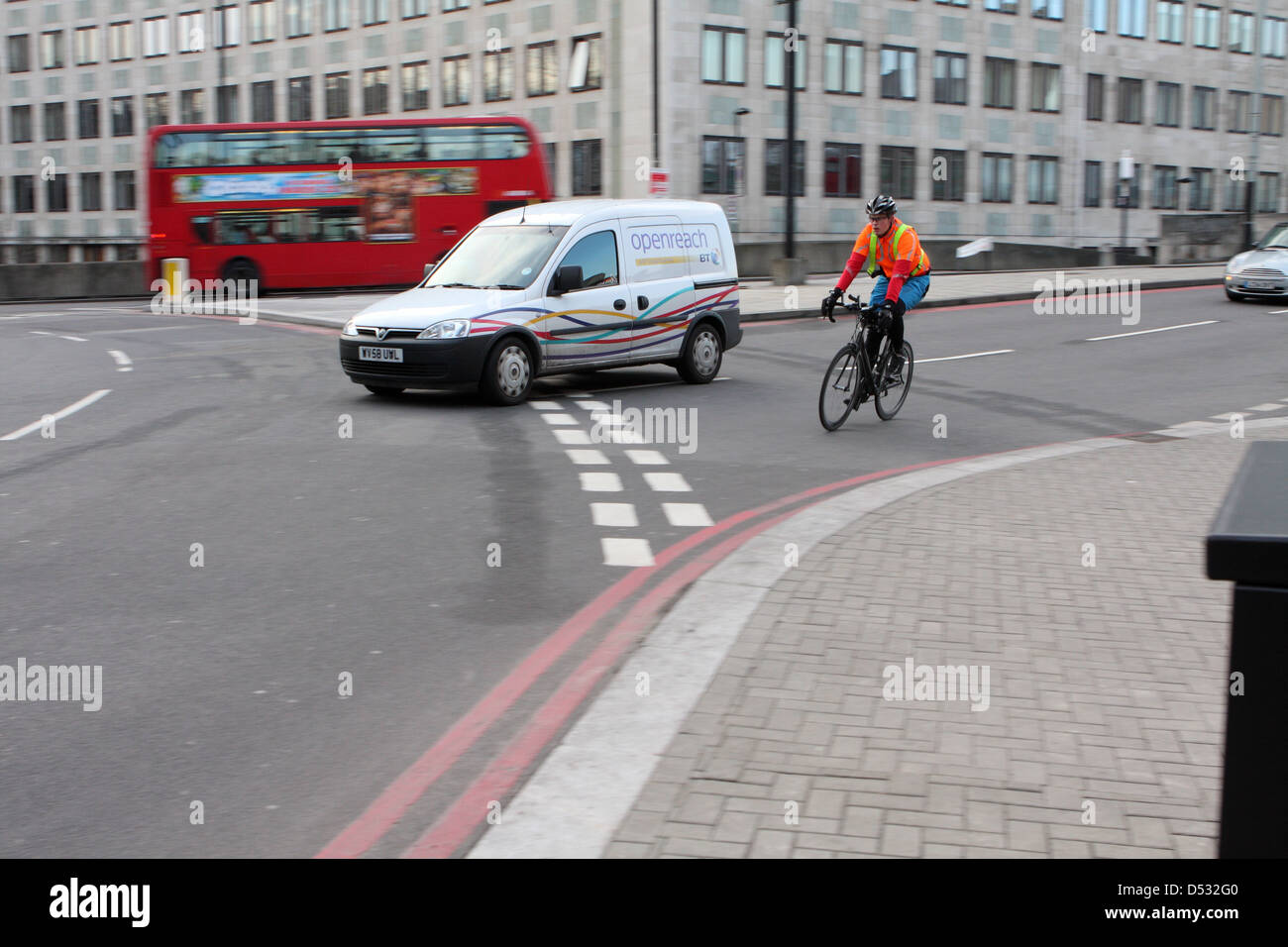 cyclist and traffic entering a roundabout in London, England Stock ...