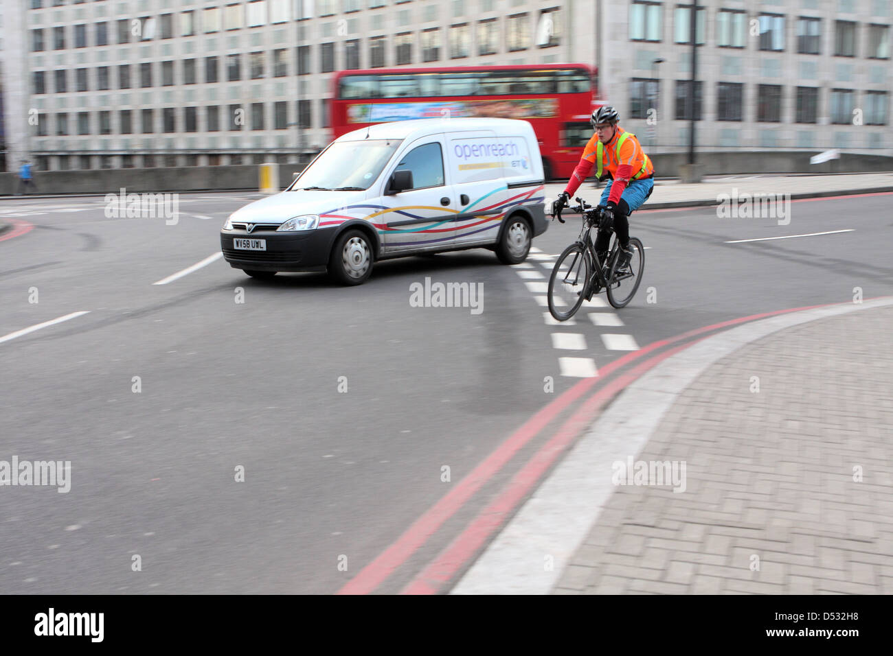 cyclist and traffic entering a roundabout in London, England Stock ...