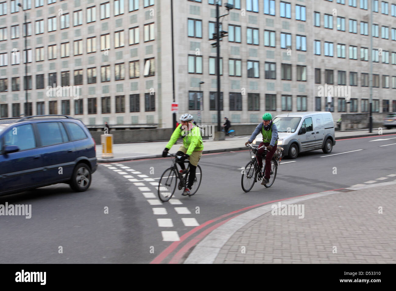 cyclists and traffic entering a roundabout in London, England Stock ...