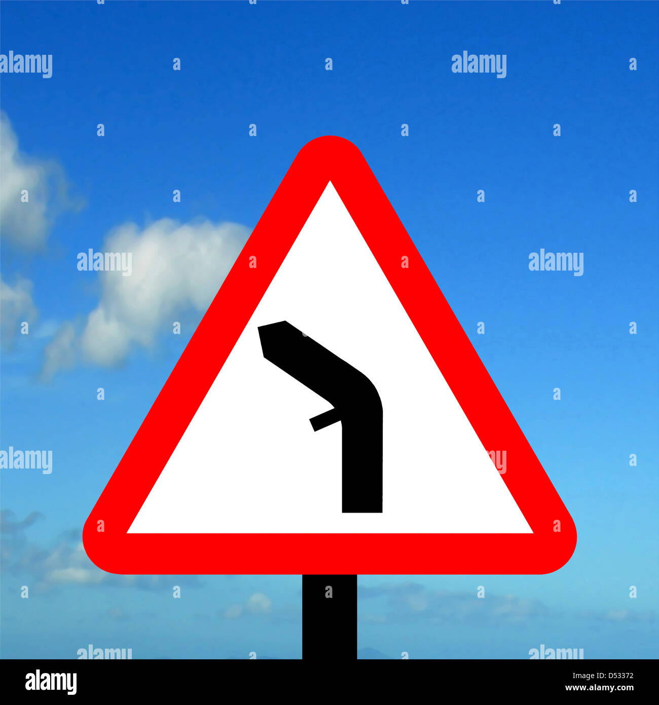 Warning triangle junction on a bend traffic sign Stock Photo - Alamy