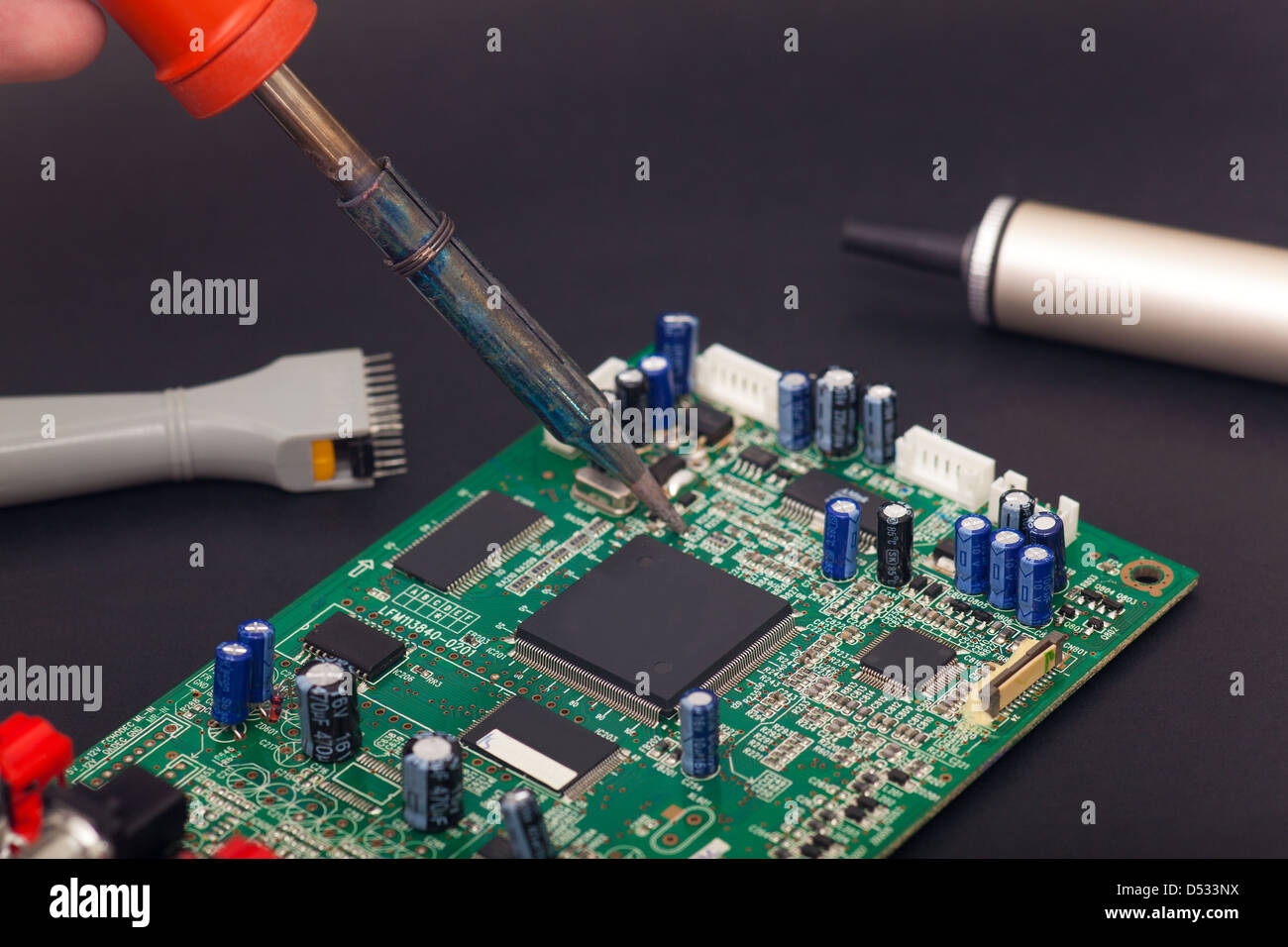 Electronic reparation in black background Stock Photo - Alamy