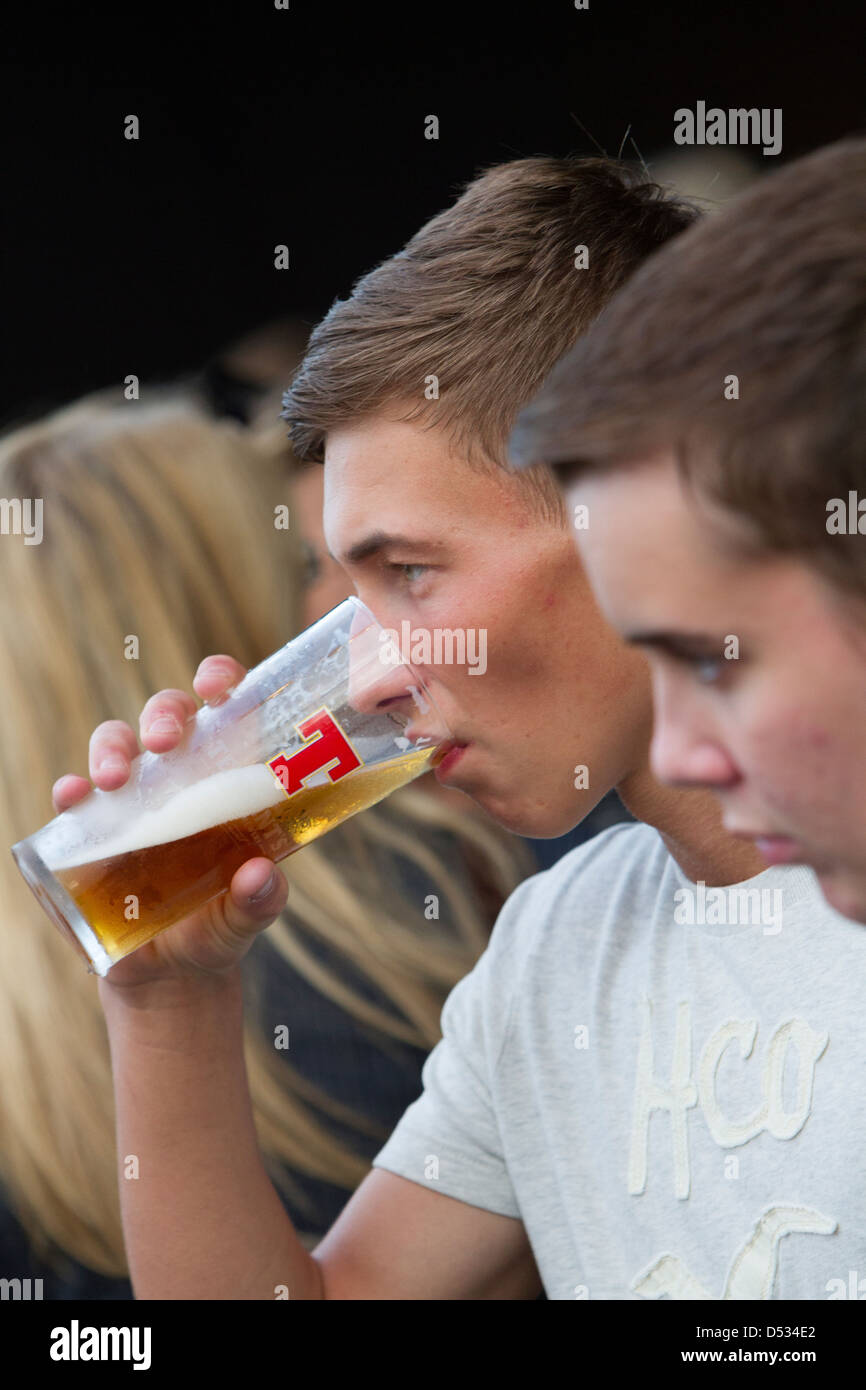 People drinking pints of larger beer Stock Photo - Alamy