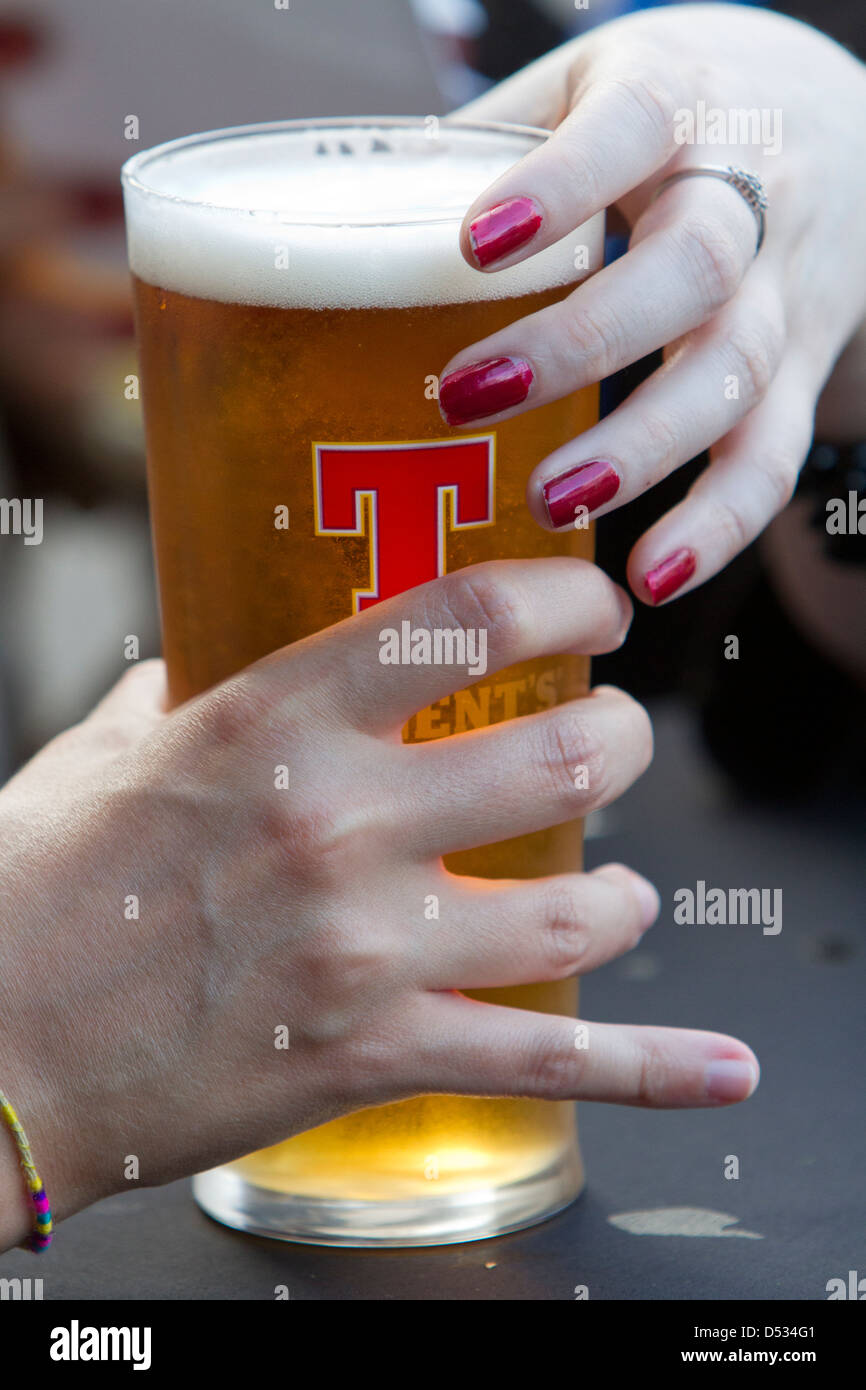 People drinking pints of larger beer Stock Photo - Alamy